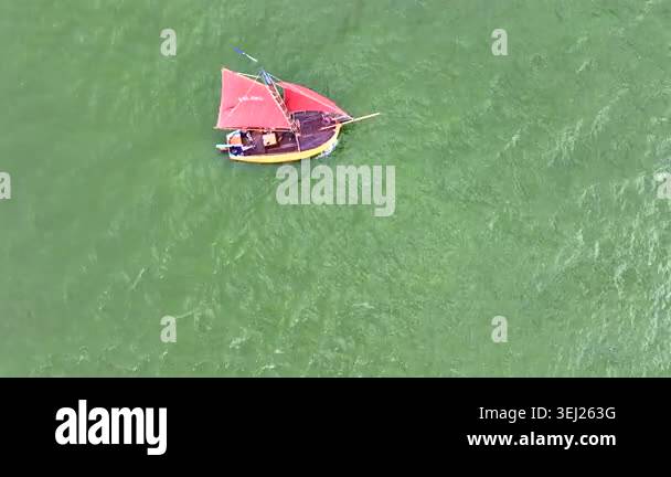 Aerial topshot of traditional sailing boats on open water near Laaxum ...