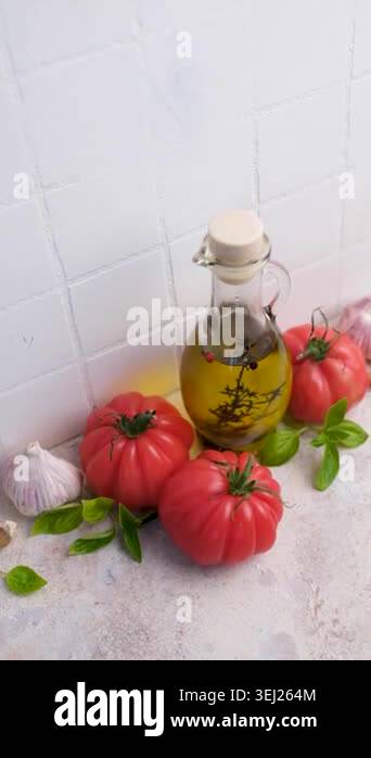 Fresh ingredients for cooking, including tomatoes, basil, pink salt ...