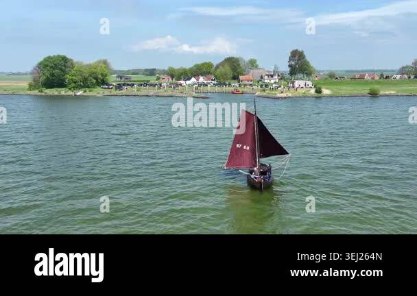 Aerial view of traditional sailing boats on open water near Laaxum in ...