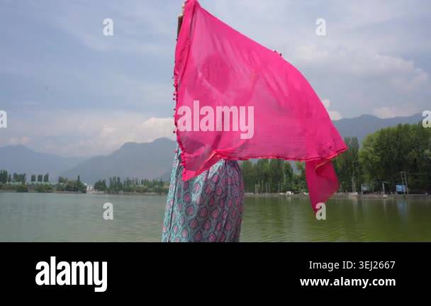Woman tourist enjoying view of water fountains in Dal Lake ,Kashmir ...