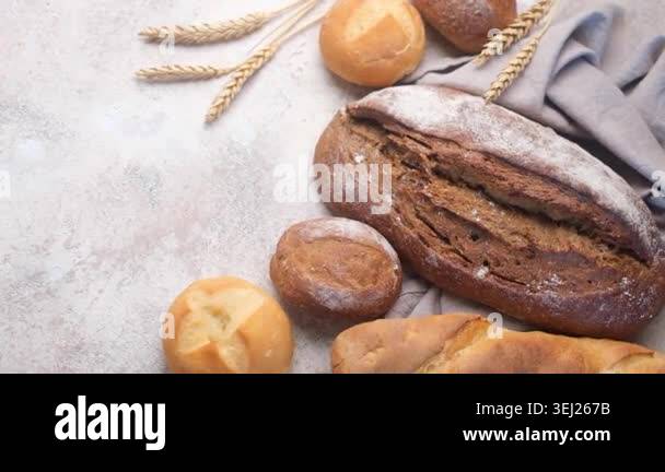 Assortment of freshly baked goods, including bread, rolls, croissants ...