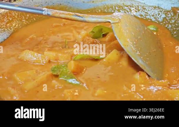 Cooking Thai red curry with pineapple in a wok Stock Video Footage - Alamy