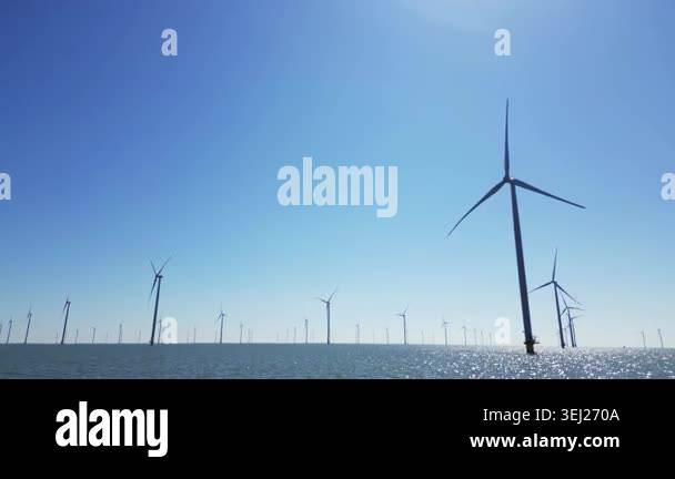 Wind turbines produce energy in the north sea, wind farm power plant ...