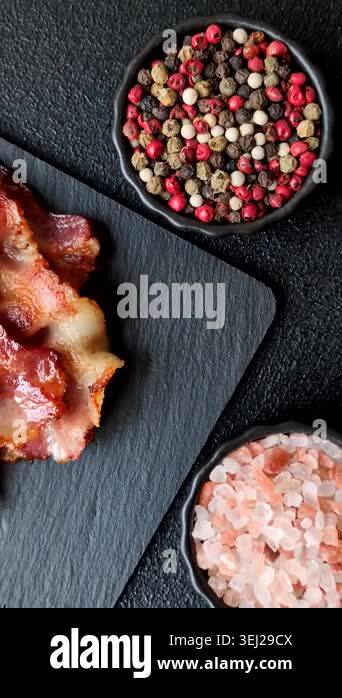 Fried fresh bacon slices with layers of meat or prosciutto with salt ...