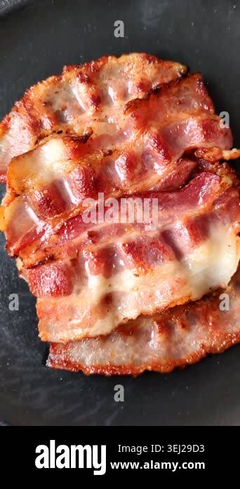 Fried fresh bacon slices with layers of meat or prosciutto with salt ...