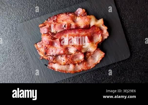 Fried fresh bacon slices with layers of meat or prosciutto with salt ...