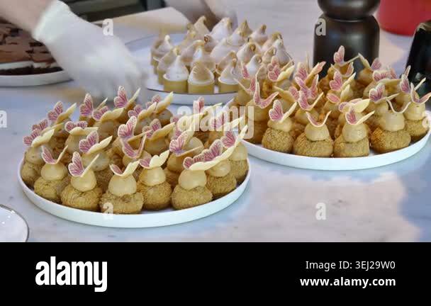Exquisite dessert selection featuring cream-filled choux pastries ...
