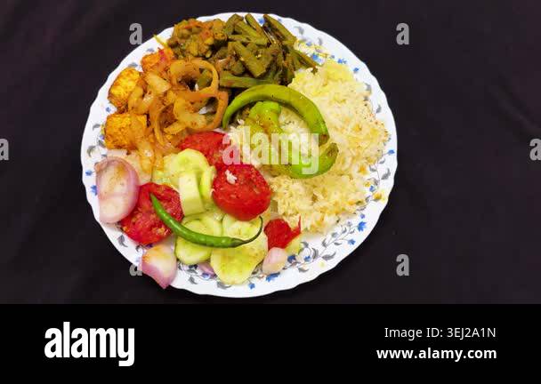 healthy indian vegetarian food plate with rice paneer salad and spicy ...