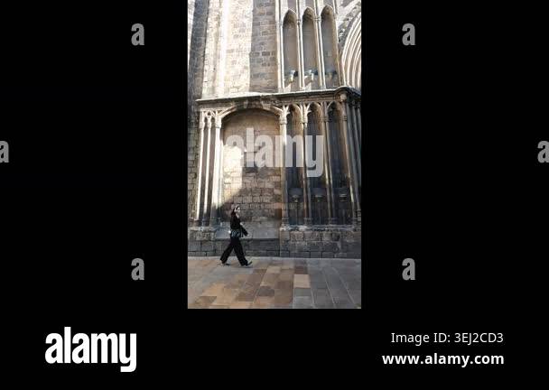 Barcelona, Spain - May 25, 2026: People walking past the historic stone ...