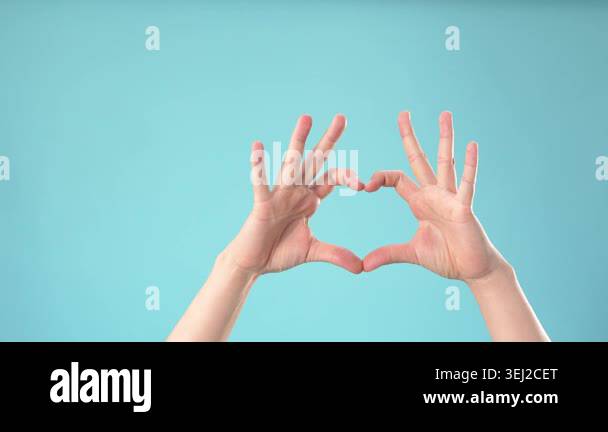 Two hands form a beautiful heart gesture on an isolated background ...
