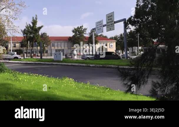 Cars driving in front of the Army Transport Regiment military base in ...