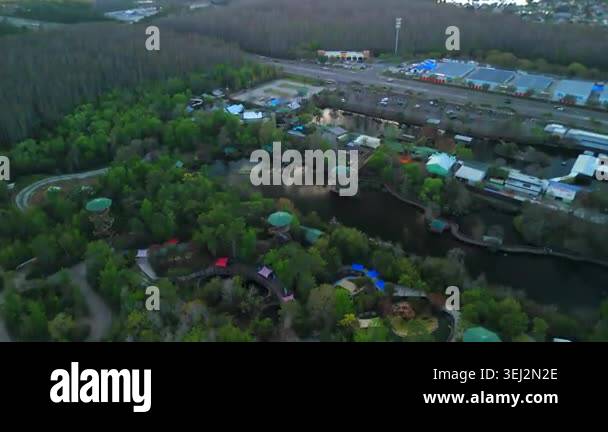 Top down drone view over Gatorland Orlando with ponds and shaded animal ...
