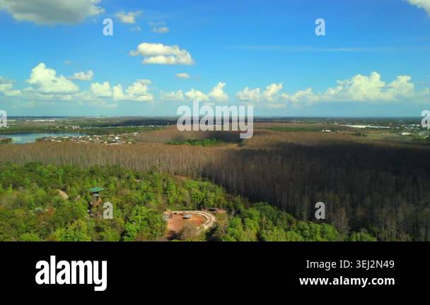Aerial drone panorama rising above Gatorland Orlando with lakes forest ...