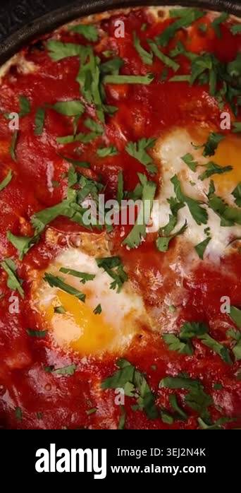 A professional chef prepares delicious fresh breakfast dishes in a ...