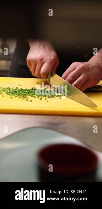 A professional chef prepares delicious fresh breakfast dishes in a ...
