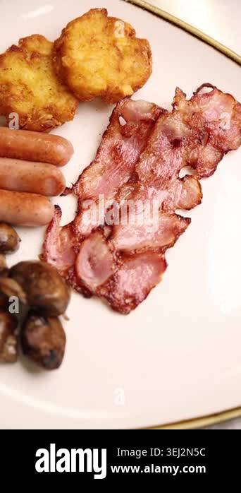 A professional chef prepares delicious fresh breakfast dishes in a ...