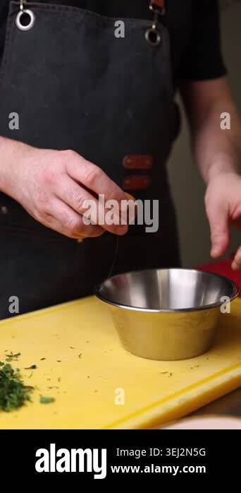 A professional chef prepares delicious fresh breakfast dishes in a ...