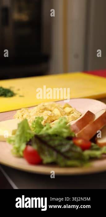 A professional chef prepares delicious fresh breakfast dishes in a ...