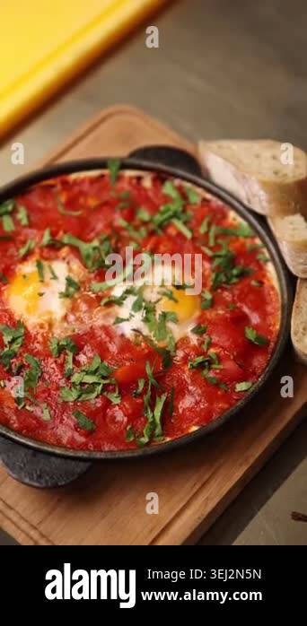 A professional chef prepares delicious fresh breakfast dishes in a ...