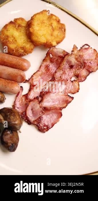 A professional chef prepares delicious fresh breakfast dishes in a ...