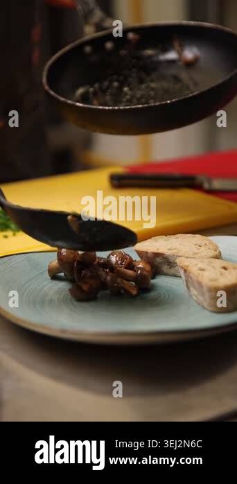 A professional chef prepares delicious fresh breakfast dishes in a ...