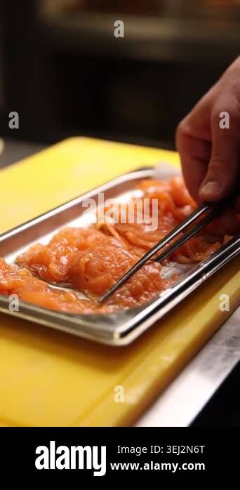 A professional chef prepares delicious fresh breakfast dishes in a ...