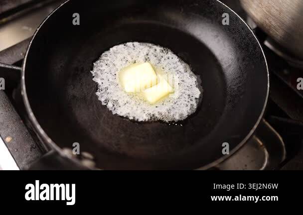 A professional chef prepares delicious fresh breakfast dishes in a ...
