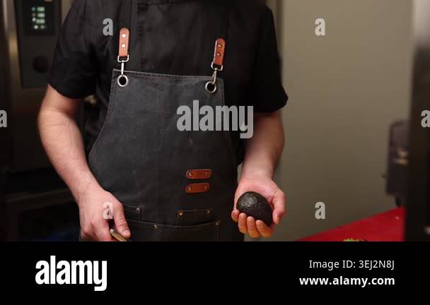 A professional chef prepares delicious fresh breakfast dishes in a ...