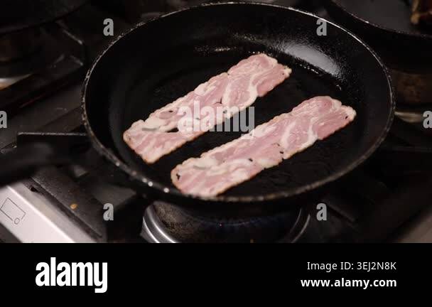 A professional chef prepares delicious fresh breakfast dishes in a ...