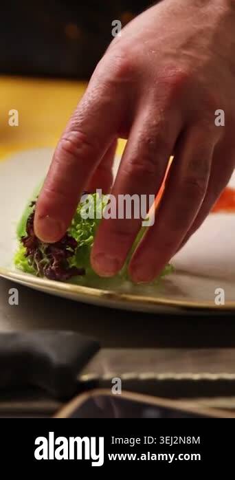 A professional chef prepares delicious fresh breakfast dishes in a ...