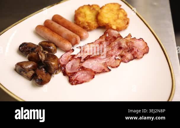 A professional chef prepares delicious fresh breakfast dishes in a ...