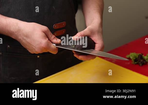 A professional chef prepares delicious fresh breakfast dishes in a ...