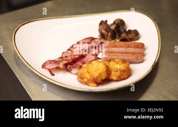 A professional chef prepares delicious fresh breakfast dishes in a ...