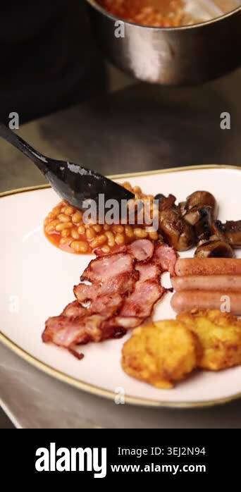 A professional chef prepares delicious fresh breakfast dishes in a ...