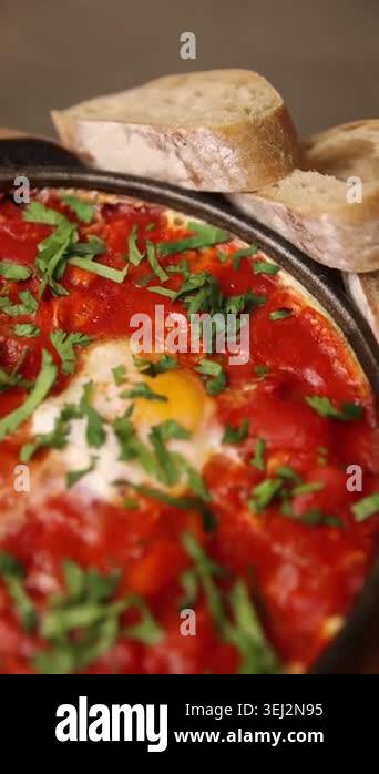 A professional chef prepares delicious fresh breakfast dishes in a ...
