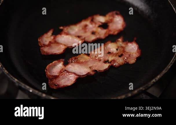 A professional chef prepares delicious fresh breakfast dishes in a ...