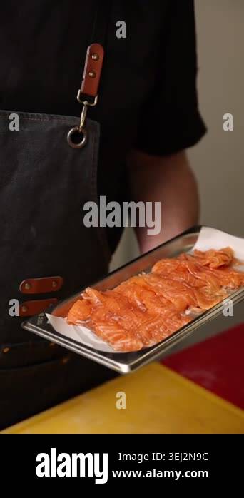 A professional chef prepares delicious fresh breakfast dishes in a ...