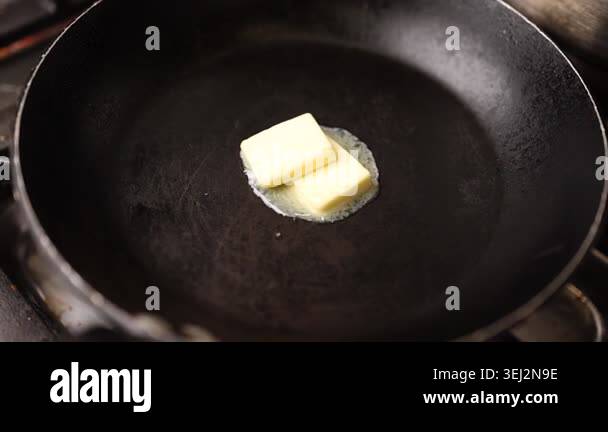 A professional chef prepares delicious fresh breakfast dishes in a ...