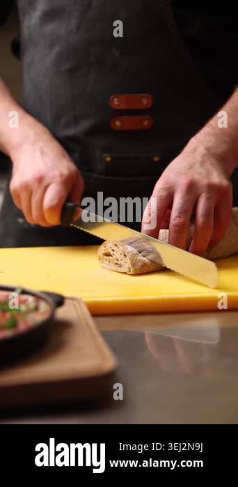 A professional chef prepares delicious fresh breakfast dishes in a ...