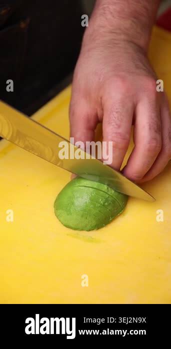 A professional chef prepares delicious fresh breakfast dishes in a ...