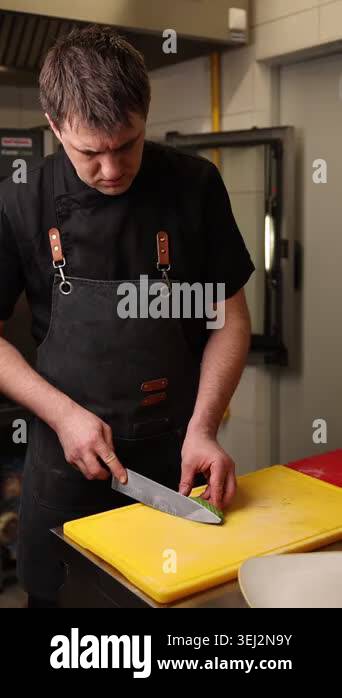 A professional chef prepares delicious fresh breakfast dishes in a ...