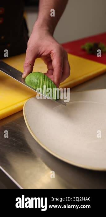A professional chef prepares delicious fresh breakfast dishes in a ...