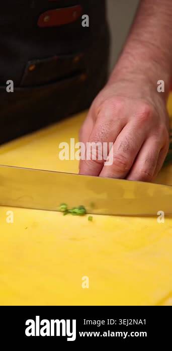 A professional chef prepares delicious fresh breakfast dishes in a ...