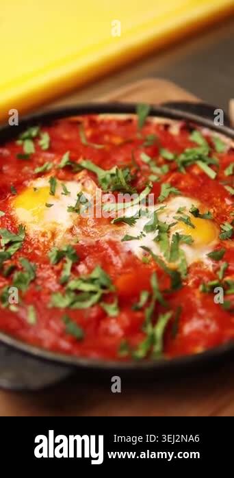 A professional chef prepares delicious fresh breakfast dishes in a ...