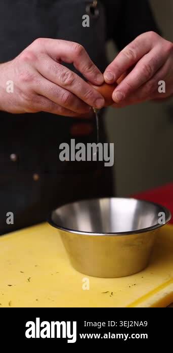 A professional chef prepares delicious fresh breakfast dishes in a ...