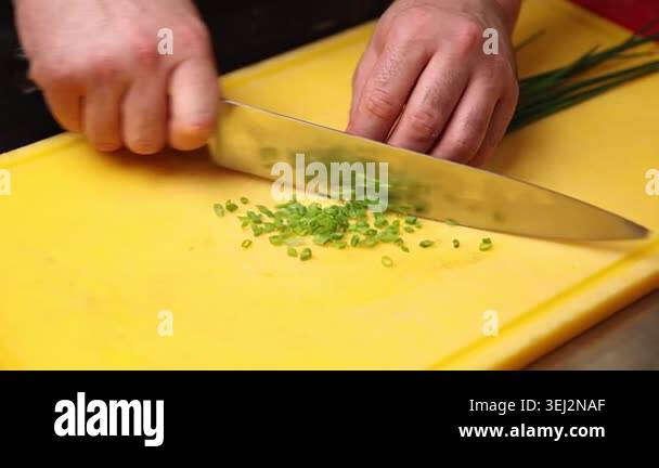 A professional chef prepares delicious fresh breakfast dishes in a ...