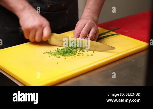 A professional chef prepares delicious fresh breakfast dishes in a ...