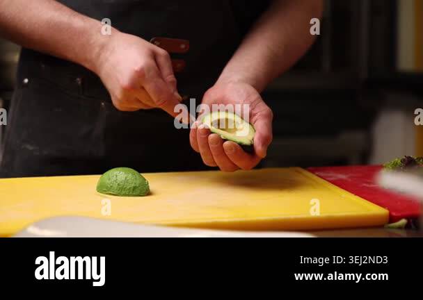 A professional chef prepares delicious fresh breakfast dishes in a ...