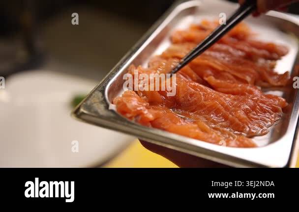 A professional chef prepares delicious fresh breakfast dishes in a ...