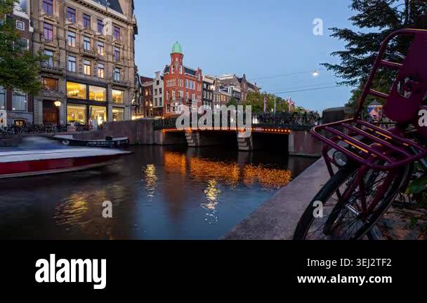 The beautiful small bridge crossing the canal Kaizersgracht in central ...